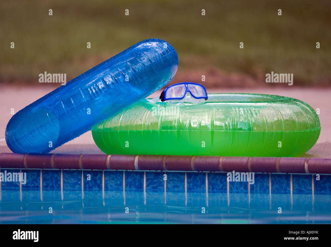 Floats by the side of a pool Stock Photo - Alamy
