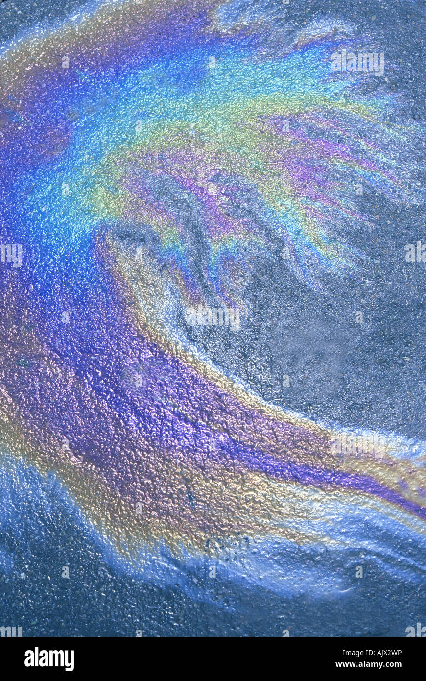 Oil slick on water on pavement Stock Photo - Alamy