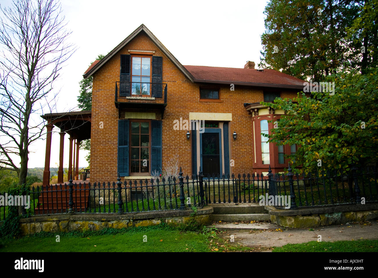 Two story yellow house porch hi-res stock photography and images - Alamy