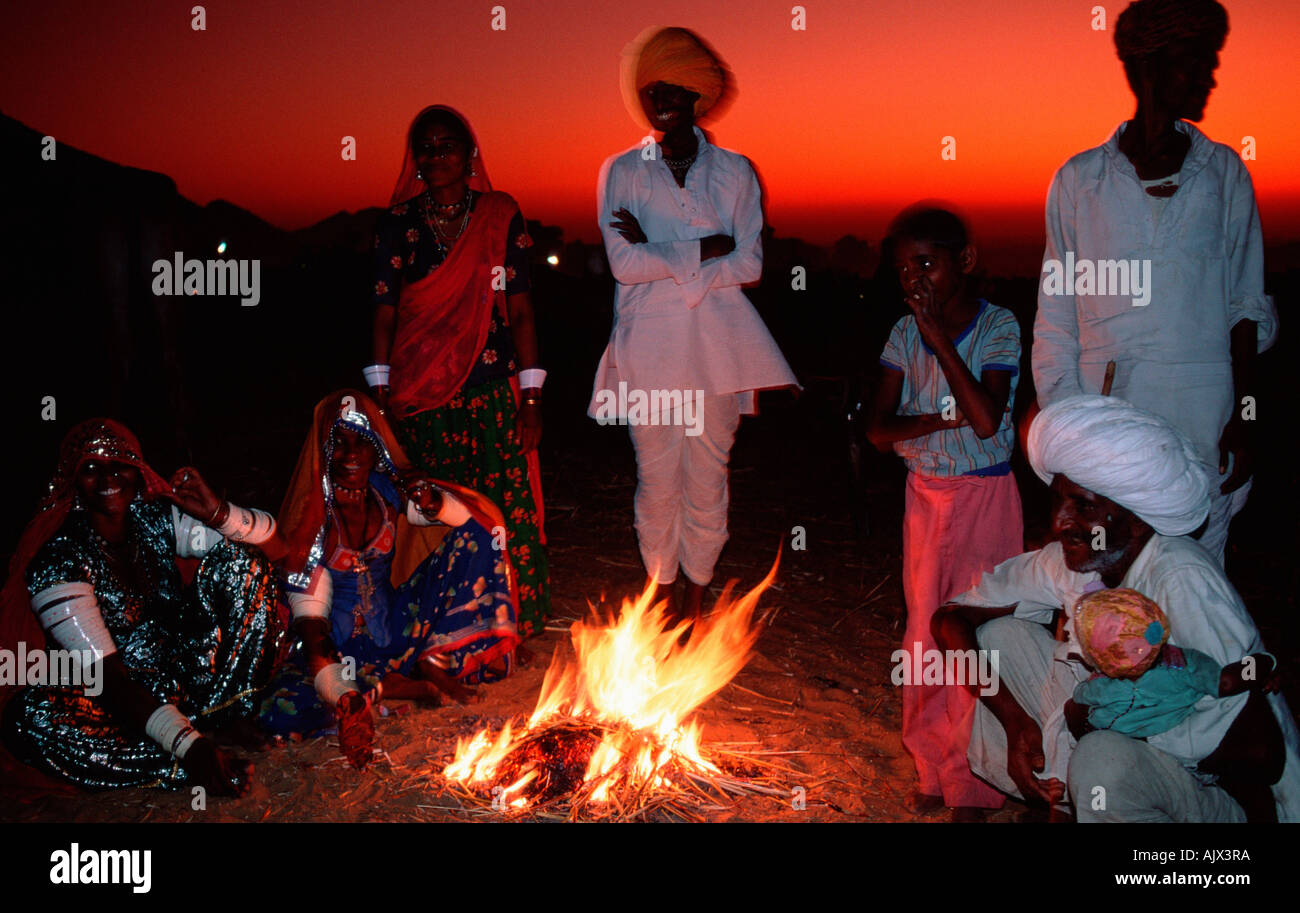 Family around camp fire Stock Photo - Alamy