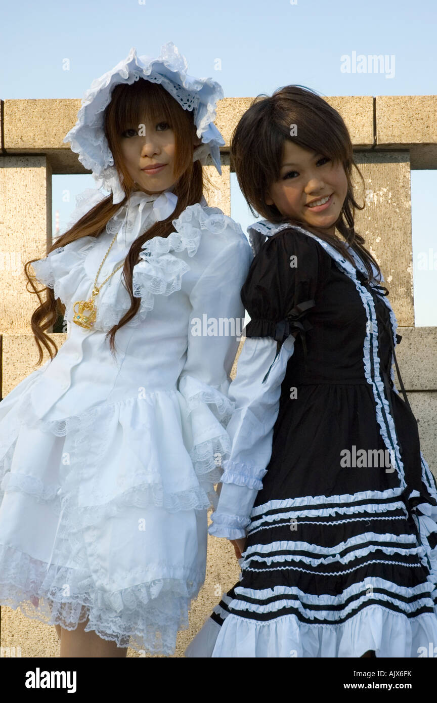 Two young Japanese women in gothic lolita costumes on Harajuku Bridge ...