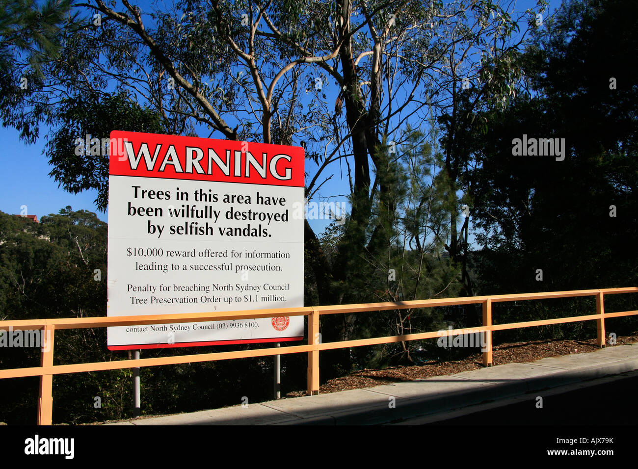 A sign warns of trees being destroyed by vandals in the Sydney ...