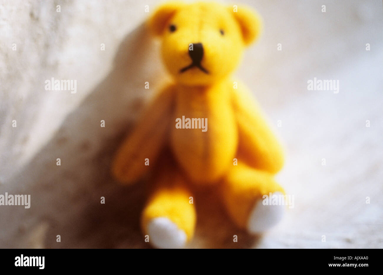Cute little teddy bear sitting on a window ledge Stock Photo - Alamy