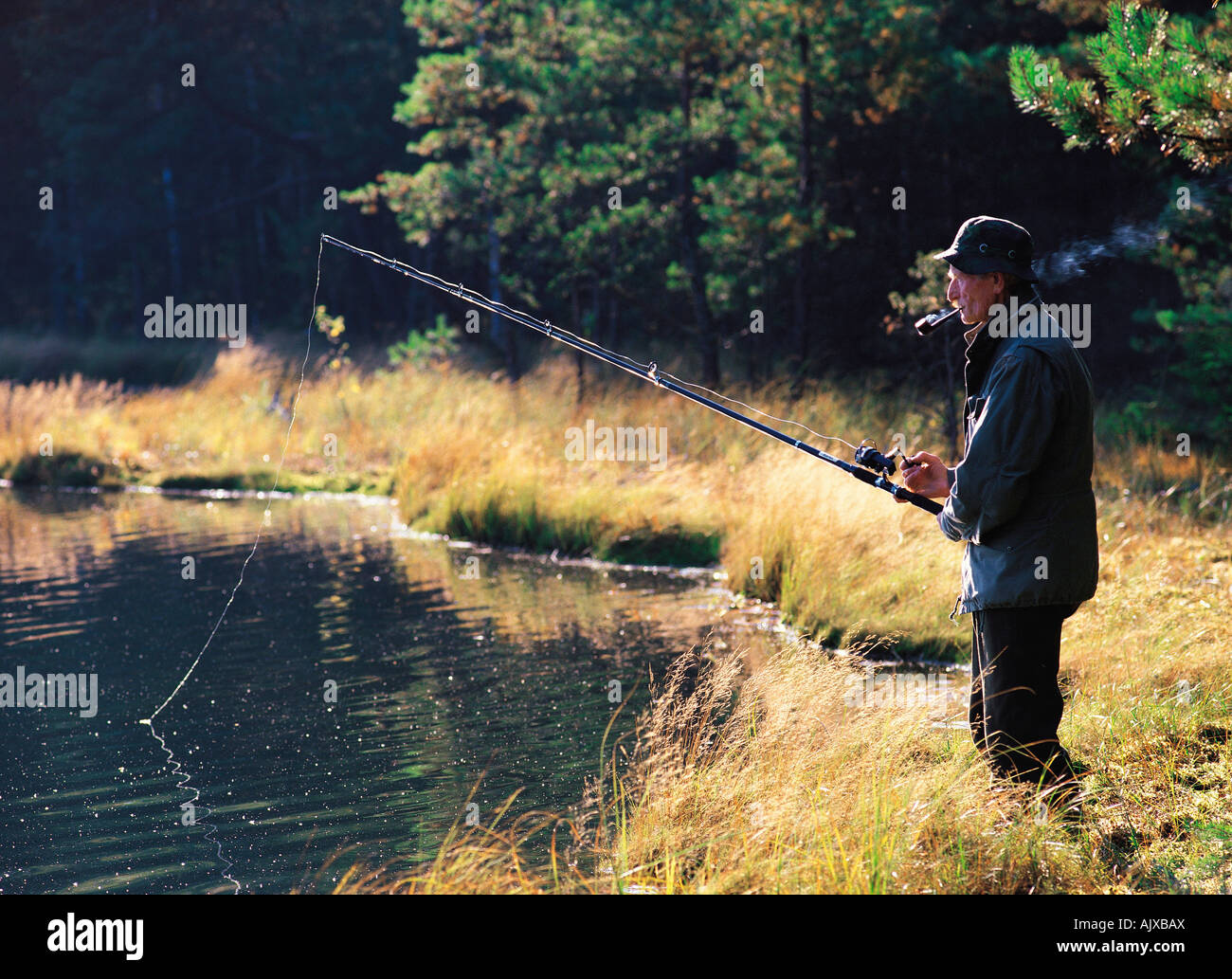 Poland. Freshwater fishing. Old gentleman on river bank Stock Photo - Alamy
