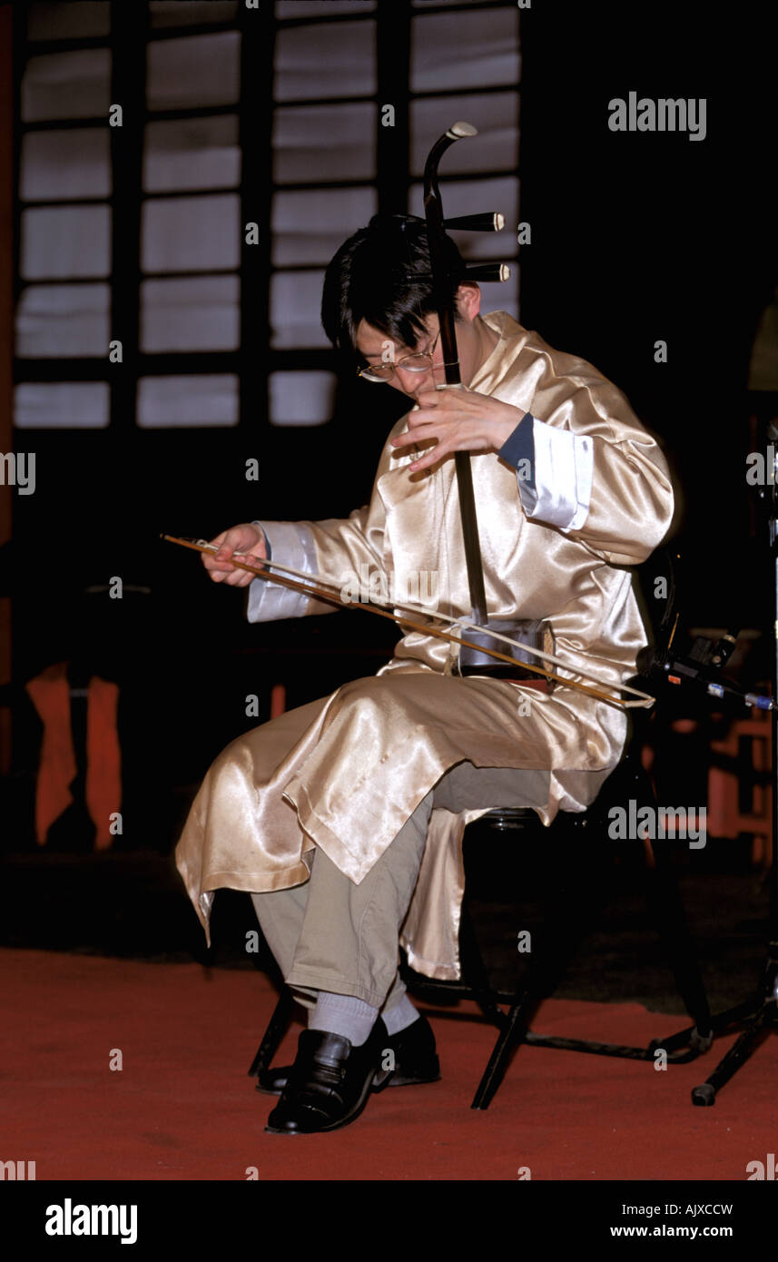 China, Sichuan Province. Musician plays Chinese violin at Sichuan Opera ...