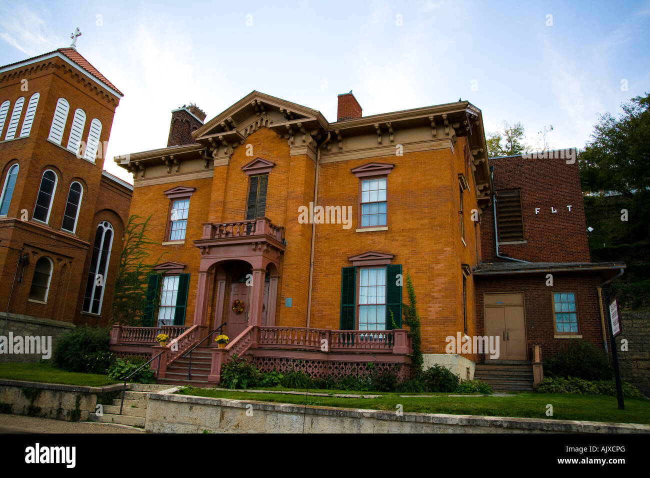 Two story yellow house porch hi-res stock photography and images - Alamy