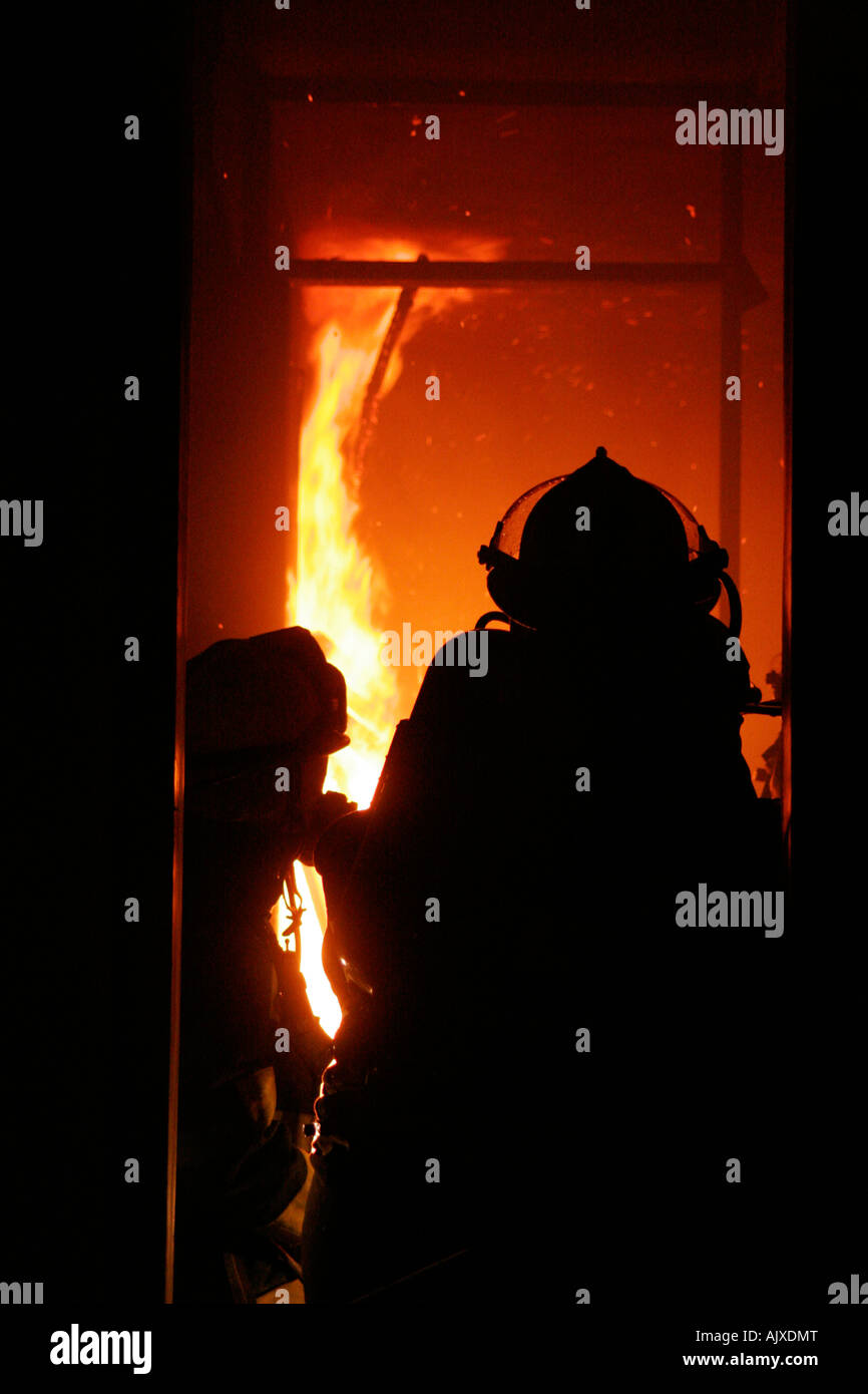 Fire fighters in a room of fire Stock Photo - Alamy