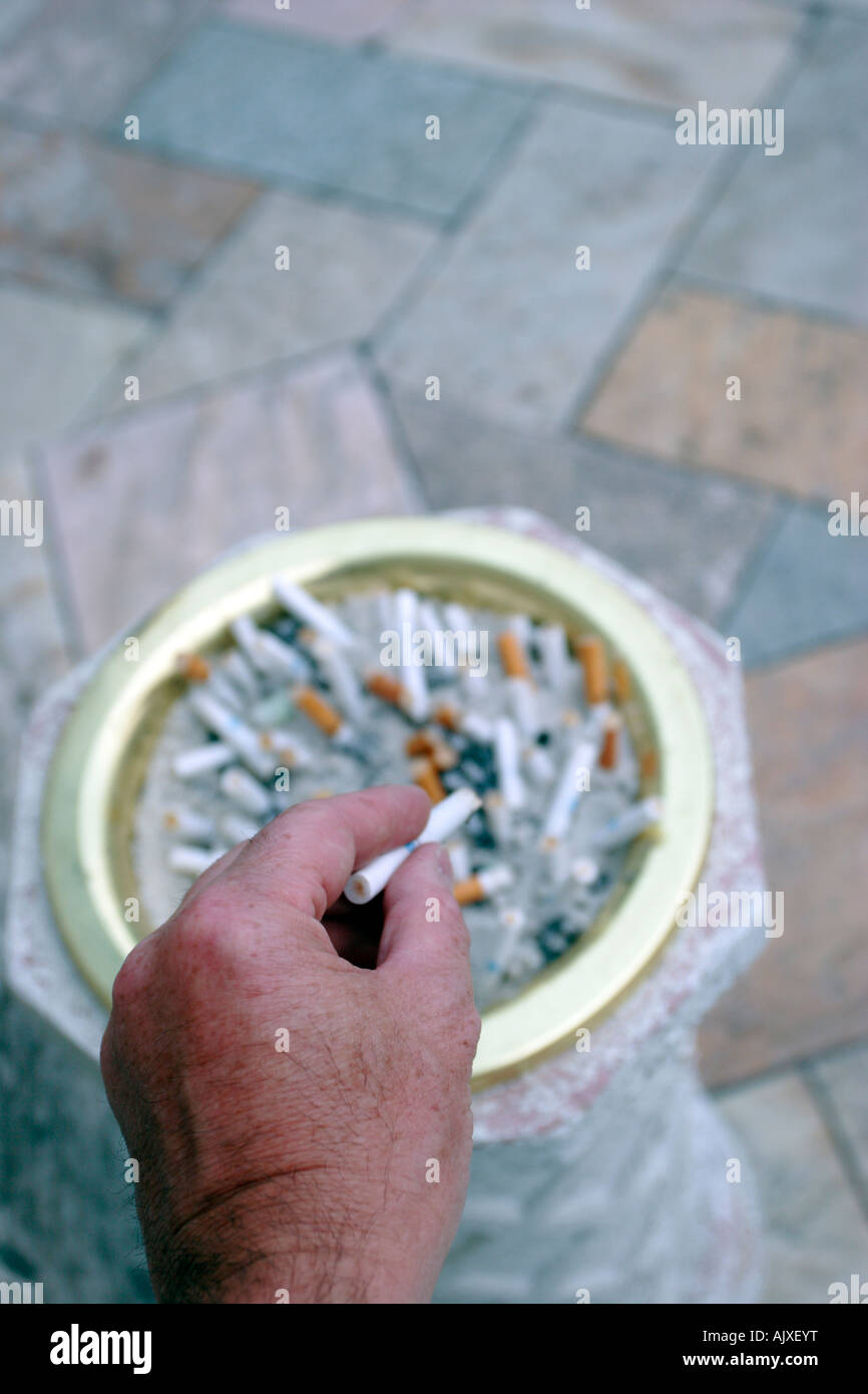 Ashtray on outdoor hotel deck Stock Photo - Alamy