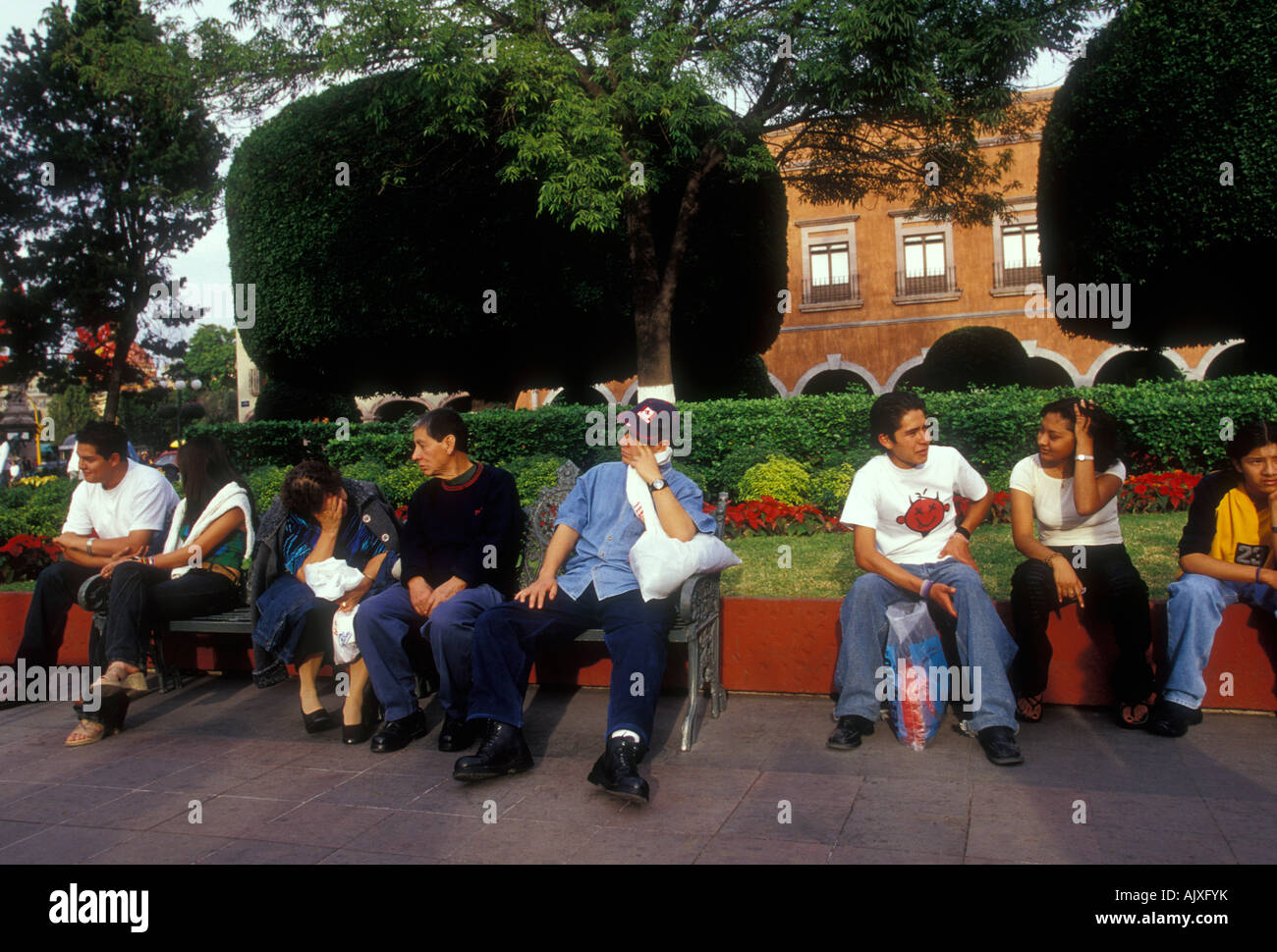 Mexican people, getting together, sitting in public park, Jardin Zenea ...