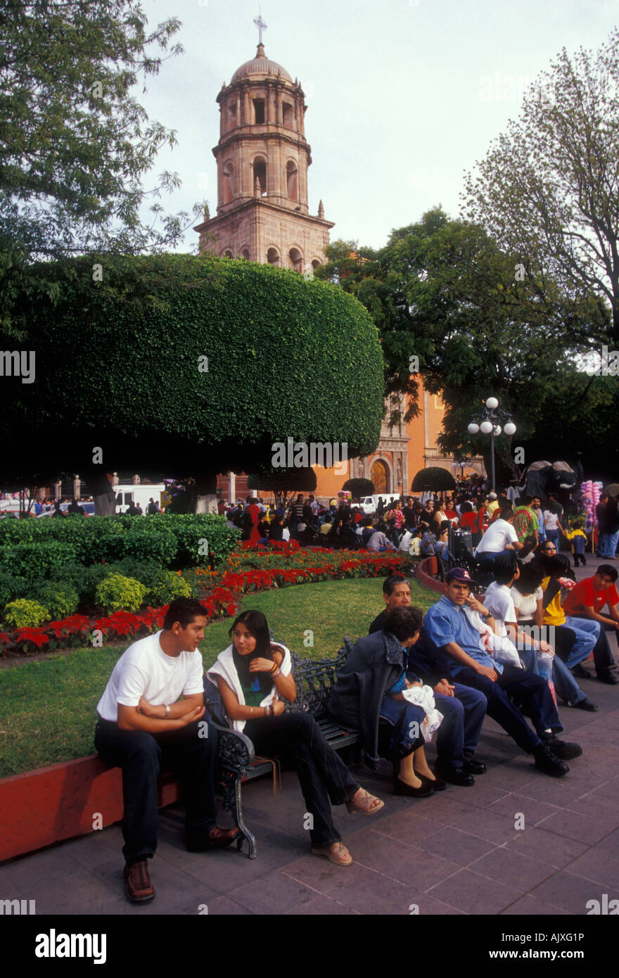 Mexican people, getting together, sitting in public park, Jardin Zenea ...