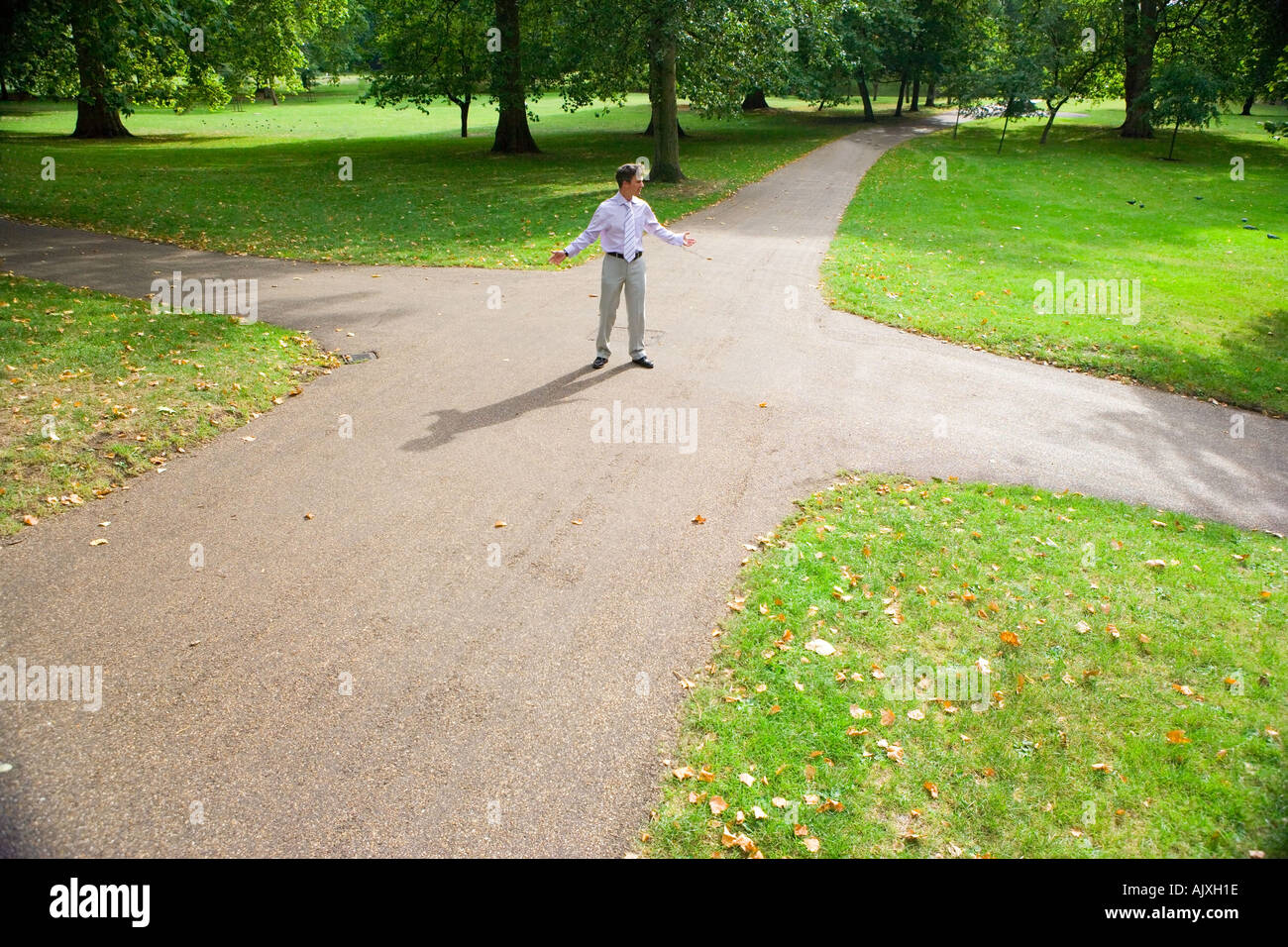 UK London Business man standing at a crossroads Stock Photo - Alamy