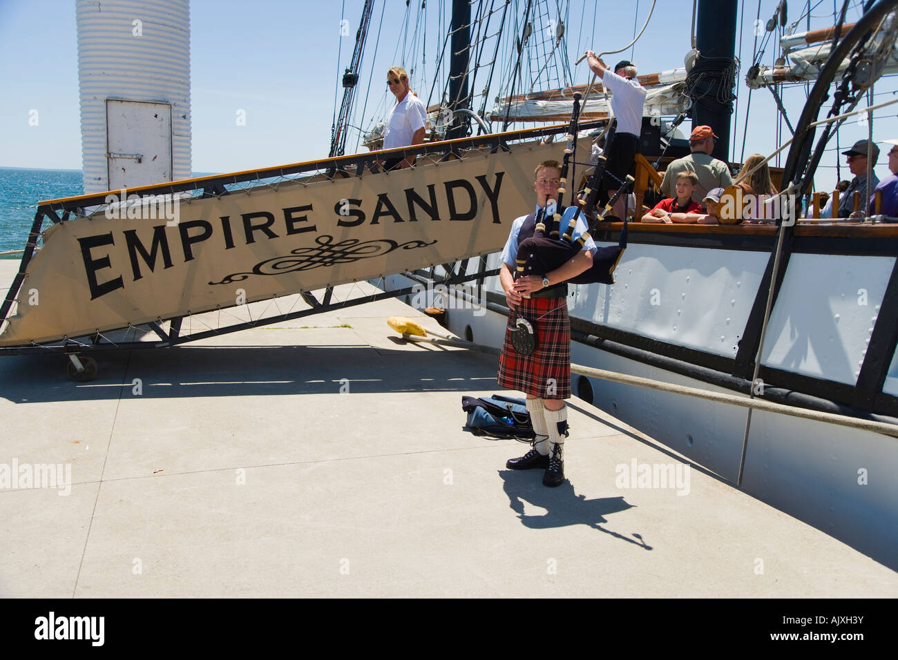 A piper welcomes passengers boarding the Empire Sandy in Bronte Harbour ...
