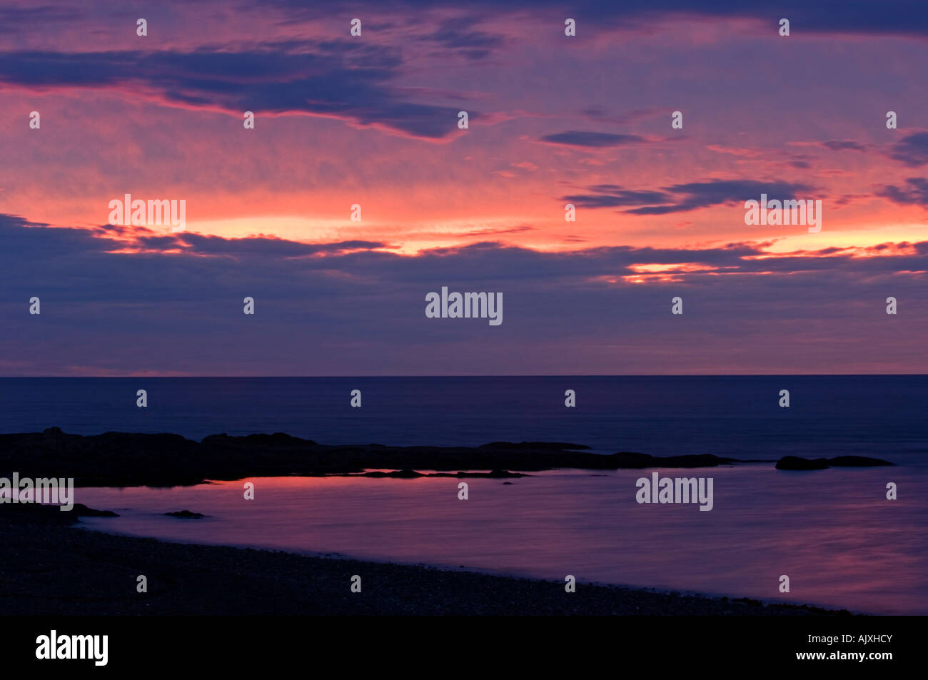 Sunset skies over Gulf of St. Lawrence near mouth of La Martre River ...