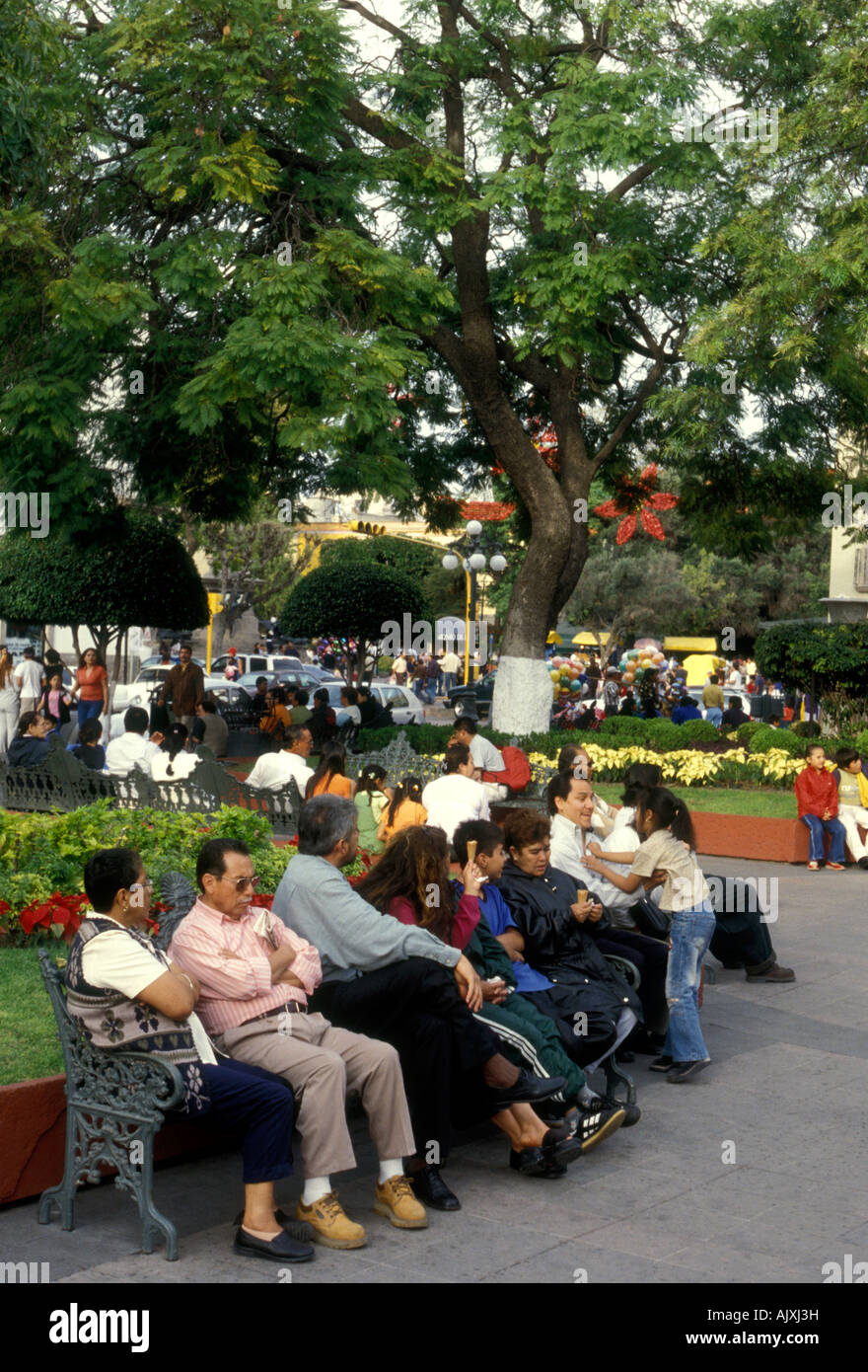 Mexican people, getting together, sitting in public park, Jardin Zenea ...