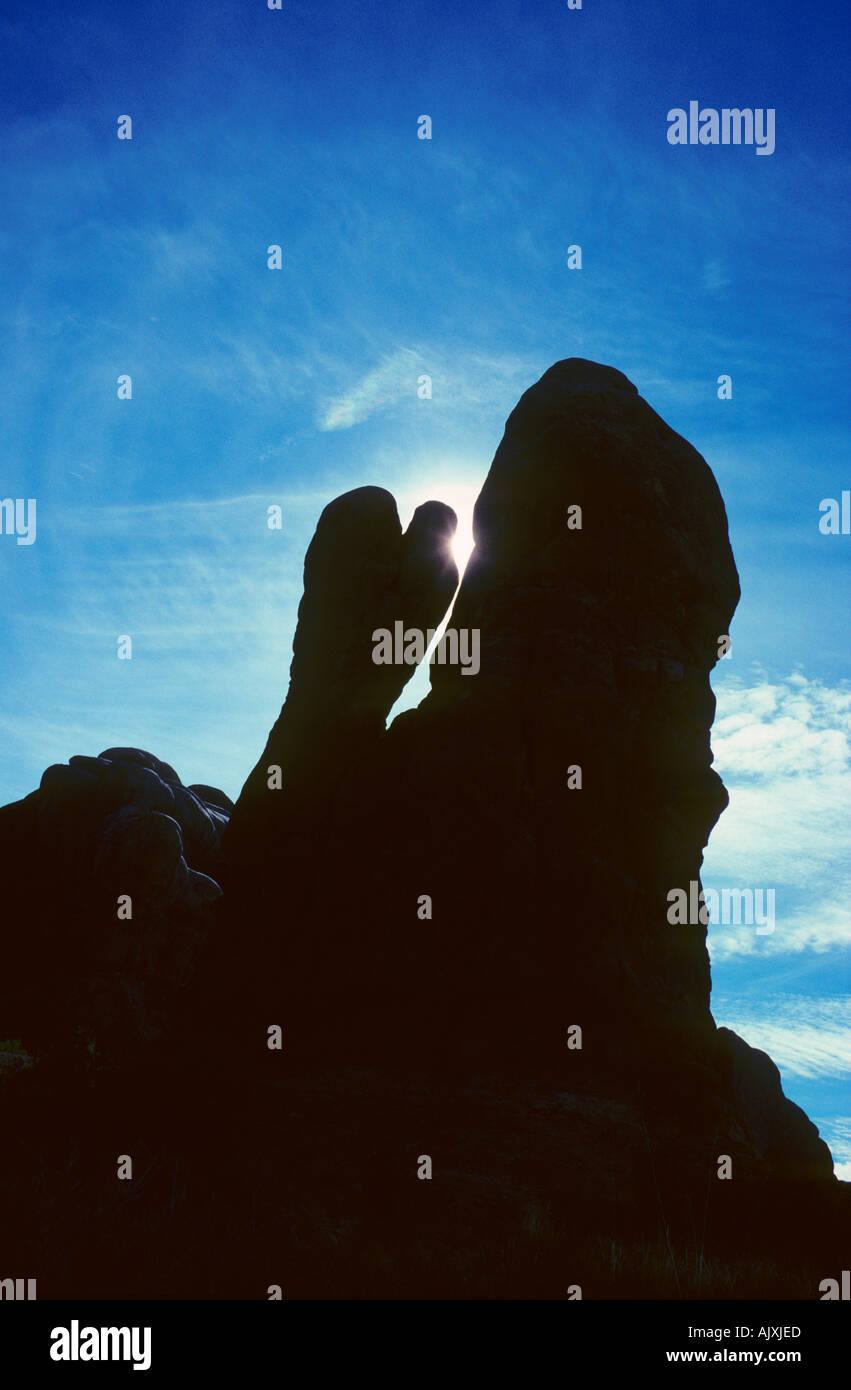 Sun shining through rock formation Arches National Park USA Stock Photo ...