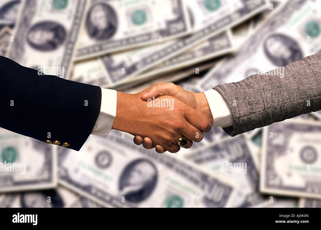 US Paper Currency and Men Shaking Hands Making Deal Stock Photo - Alamy