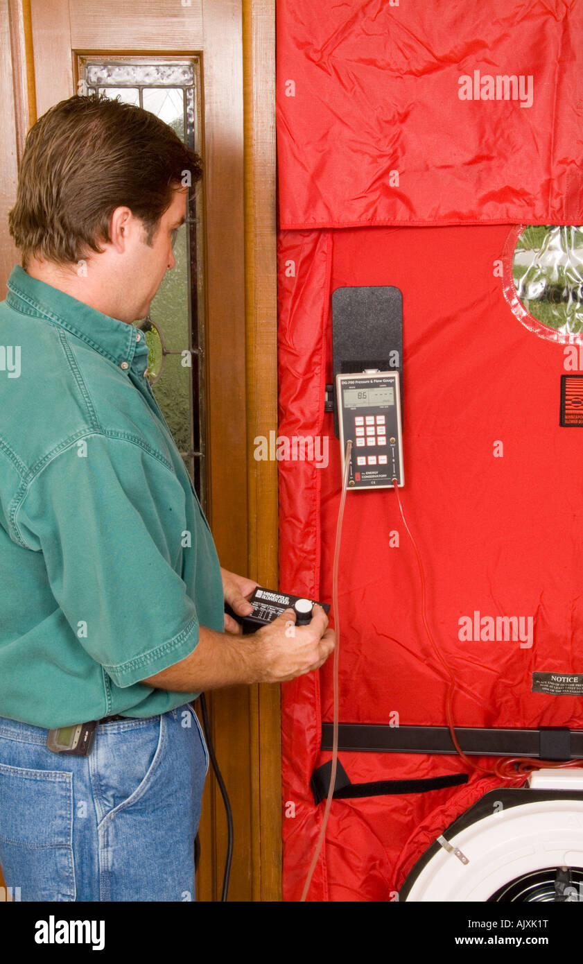 Man checking with guages and technical equipment a home to see how much ...