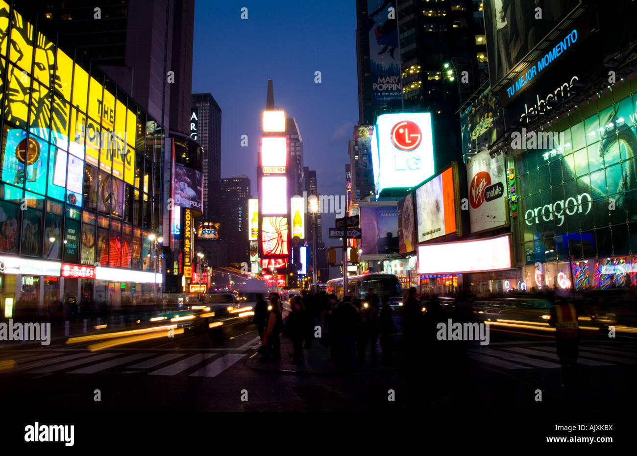 World famous Times Square at night with excitement florescent signs and ...