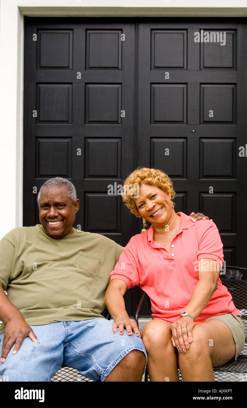 Senior retired black african american couple proudly sit in front of ...