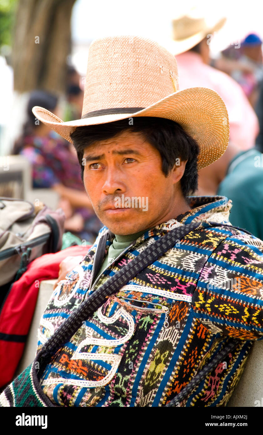 Great image of costume man in colorful print fabric in park with cowboy ...