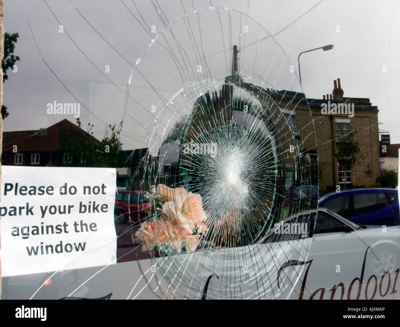 Broken safety glass shop window Stock Photo - Alamy