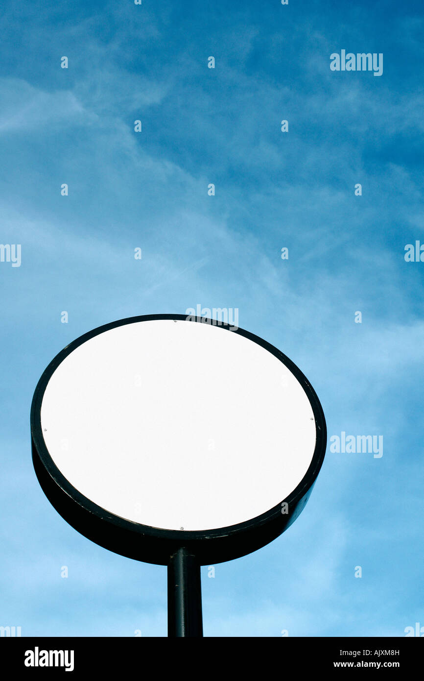Circular White Sign on a Pole Against a Clear Blue Sky on a Sunny Day ...