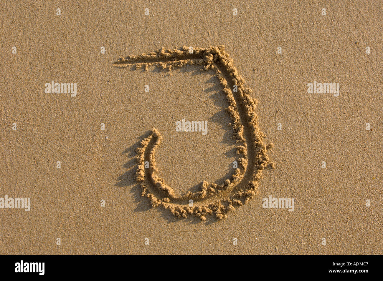 Alphabet hand writen letters on the sand Stock Photo - Alamy