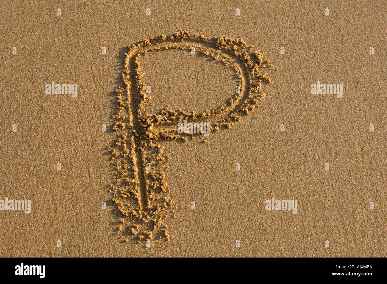 Alphabet hand writen letters on the sand Stock Photo - Alamy
