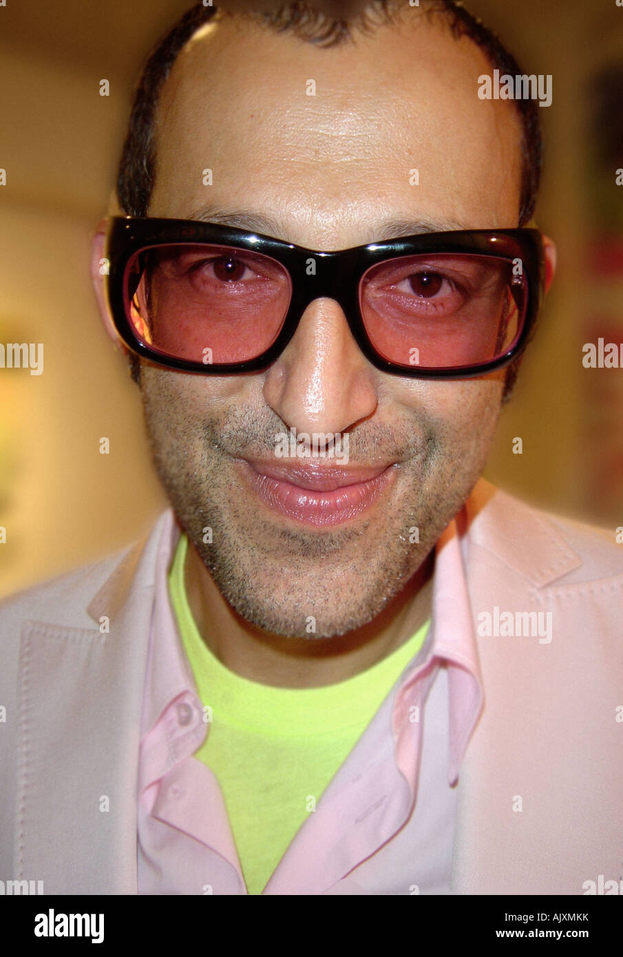Candid Portrait of Industrial Designer Karim Rashid wearing a pink suit ...