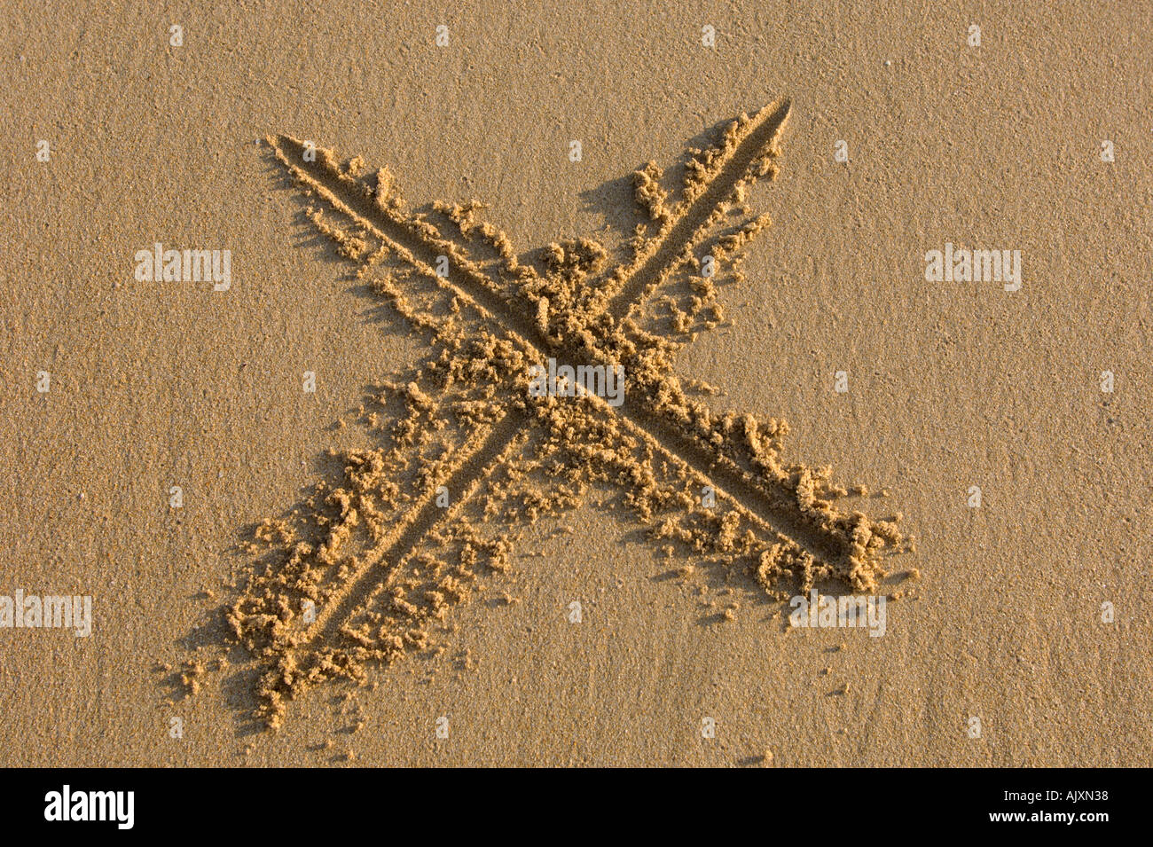 Alphabet hand writen letters on the sand Stock Photo - Alamy