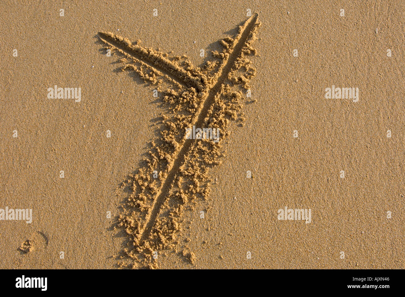 Alphabet hand writen letters on the sand Stock Photo - Alamy