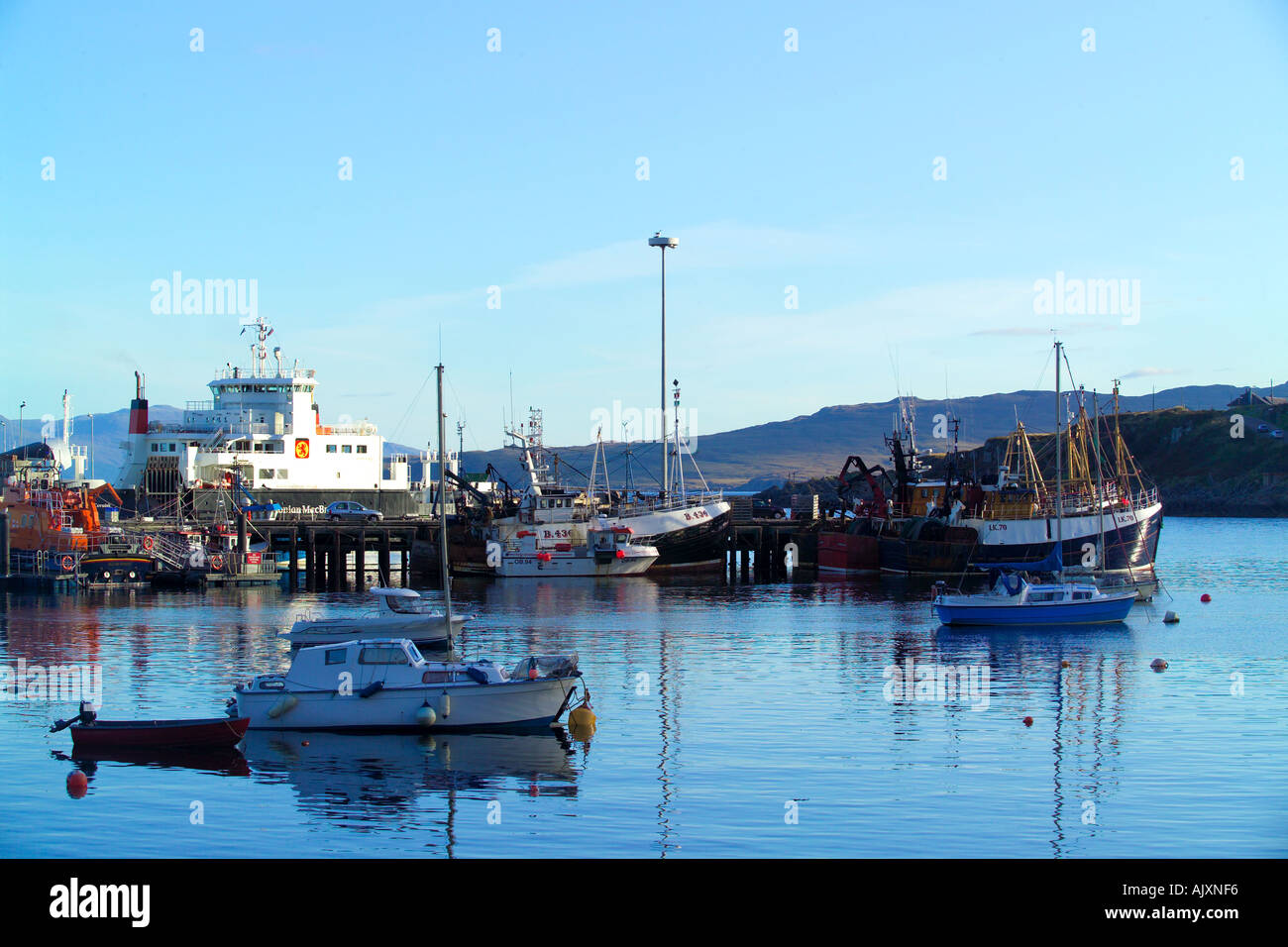 The fishing Village of Mallaig Scotland with the Isle of Skye in the ...