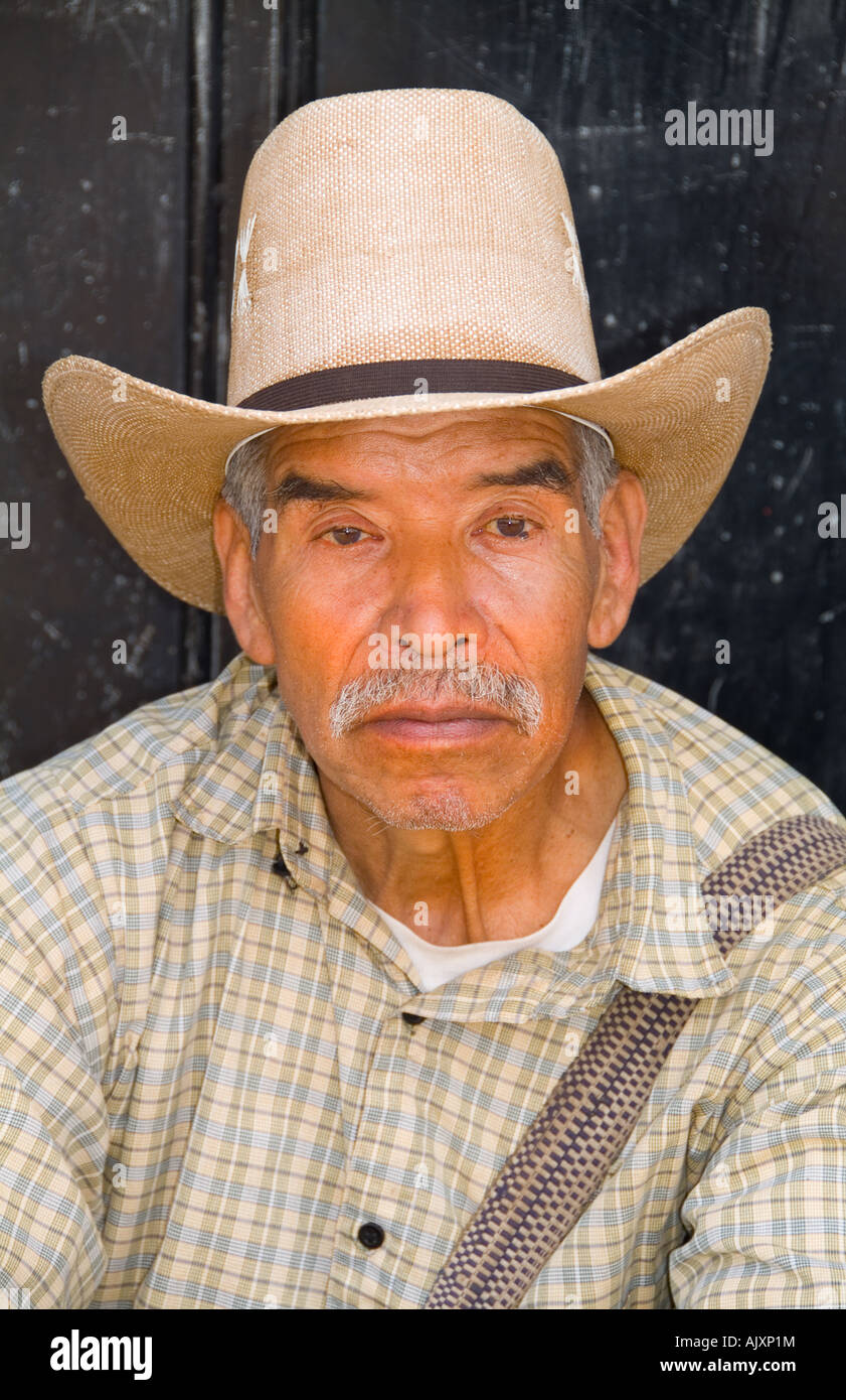 Poor man portrait in cowboy hat portrait in Lake Atitlan village of San ...