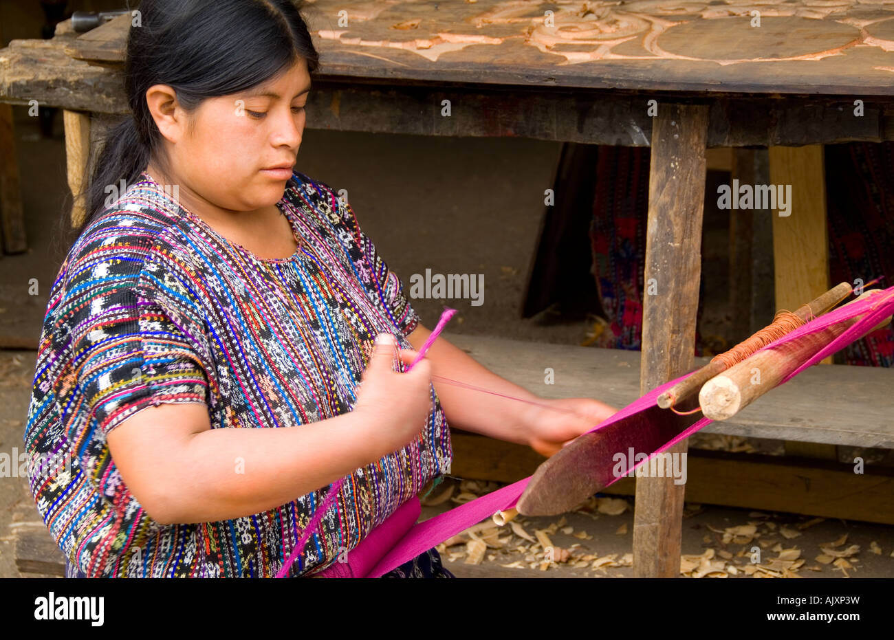 Woman weaving fabrics in small village outside of Antigua Guatemala in ...