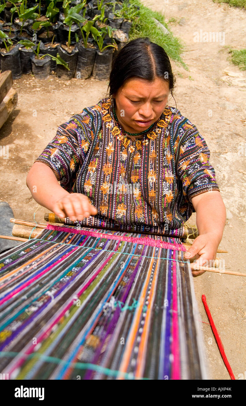 Woman weaving fabrics in small village outside of Antigua Guatemala in ...