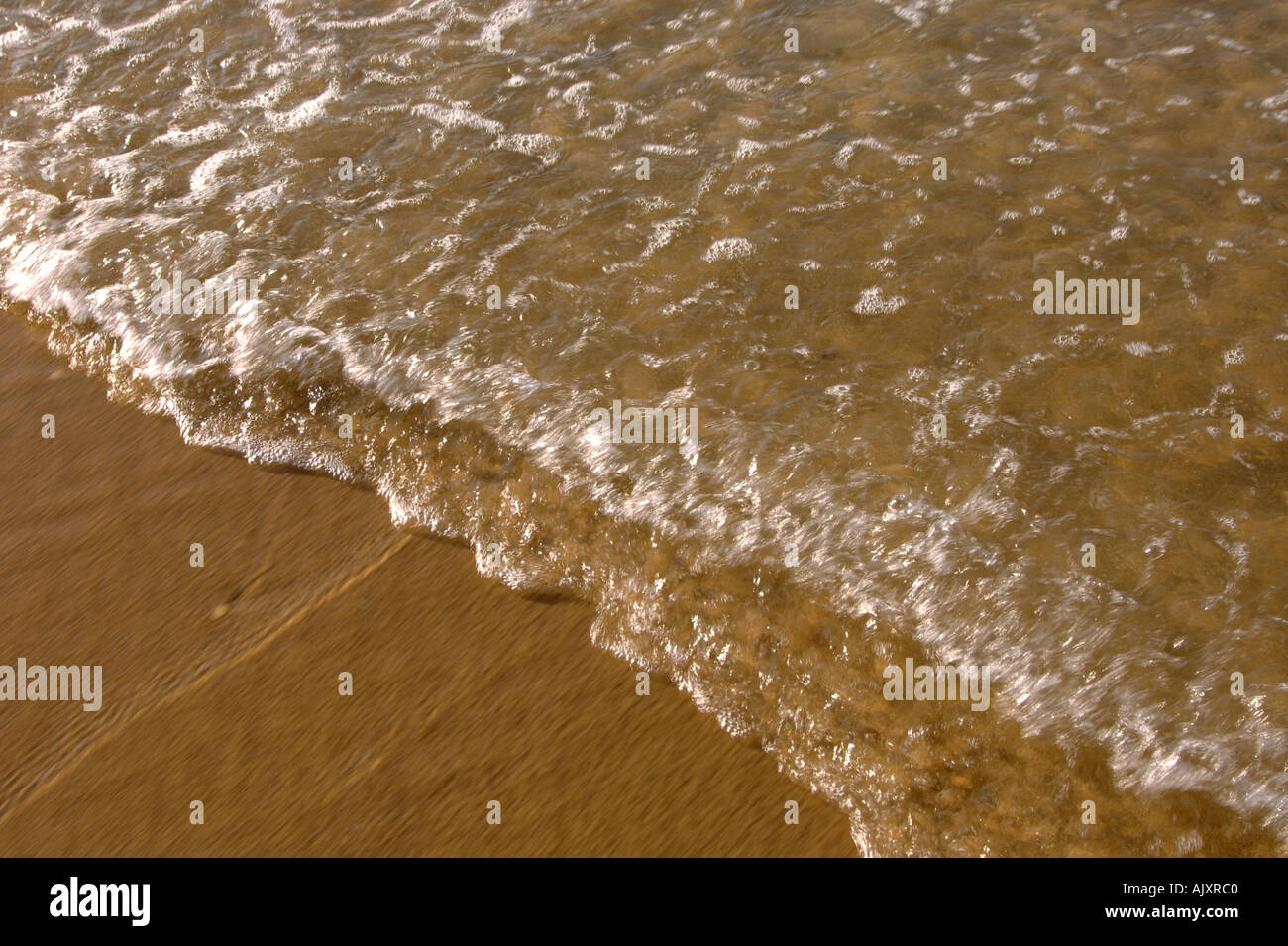 small wave on the beach Stock Photo - Alamy