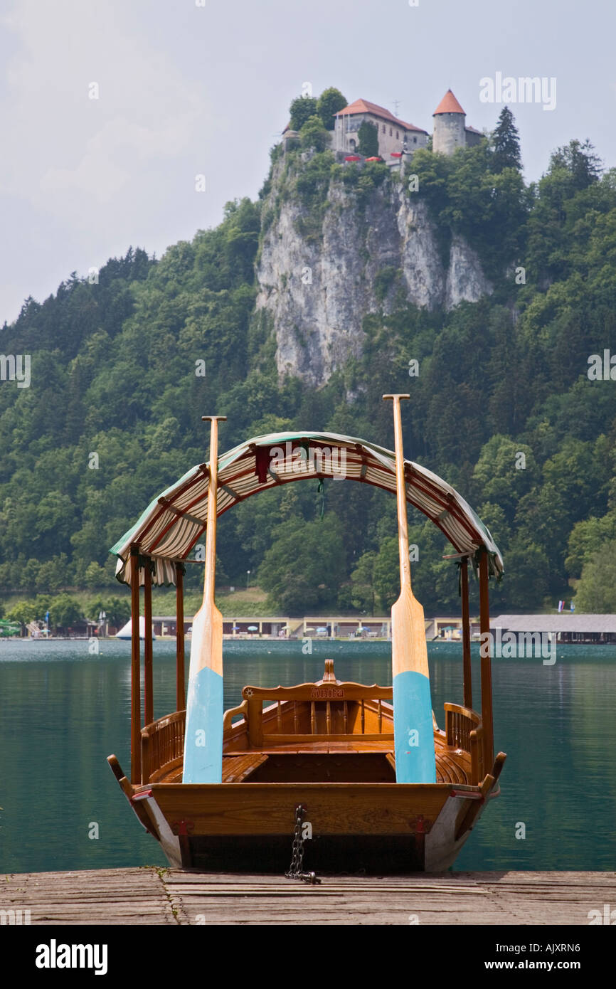 Lake Bled in summer with oars on traditional wooden pletnja rowing boat ...