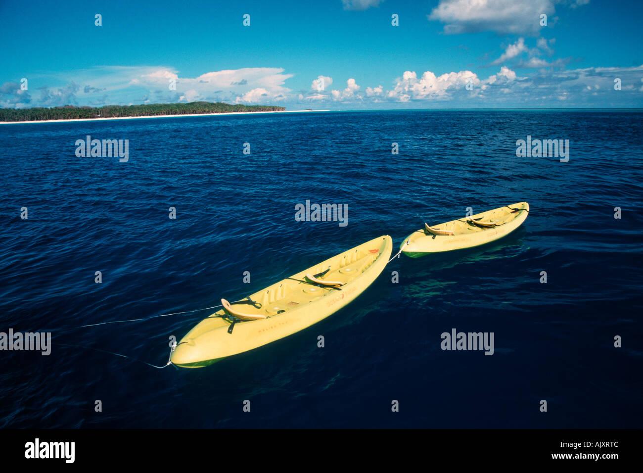 Two kayaks drift on a lagoon Sorol atoll Yap State Federated States of ...