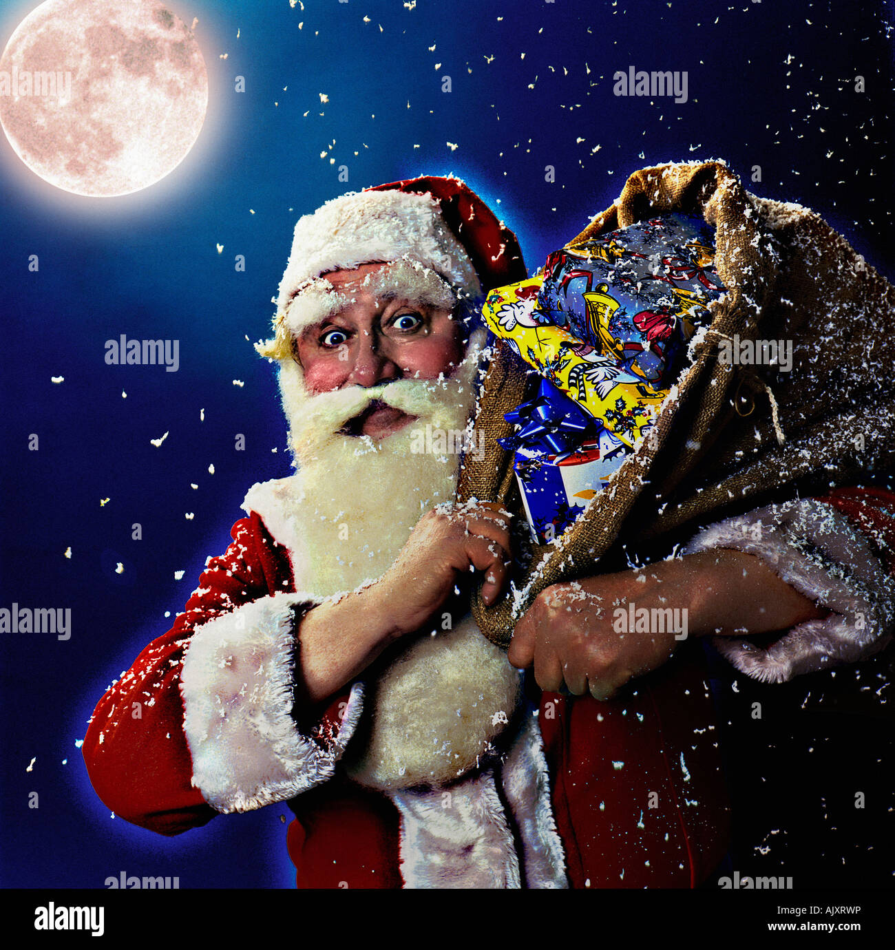 Santa Claus with a sack of presents Stock Photo - Alamy