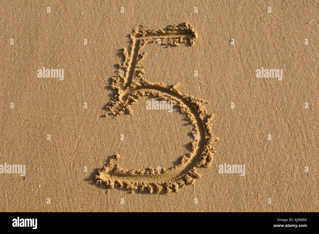 number hand writing numbers on the sand Stock Photo - Alamy