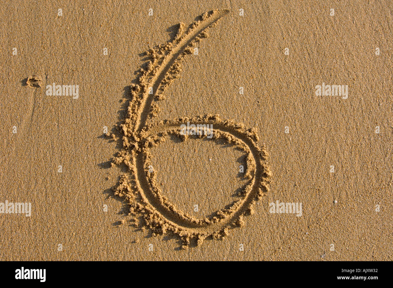 number hand writing numbers on the sand Stock Photo - Alamy