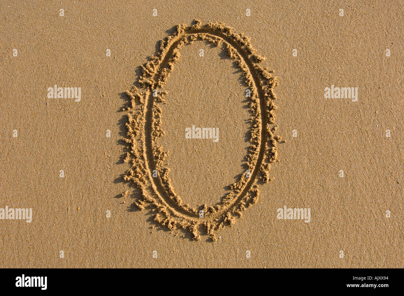 number 0 hand writing numbers on the sand Stock Photo - Alamy