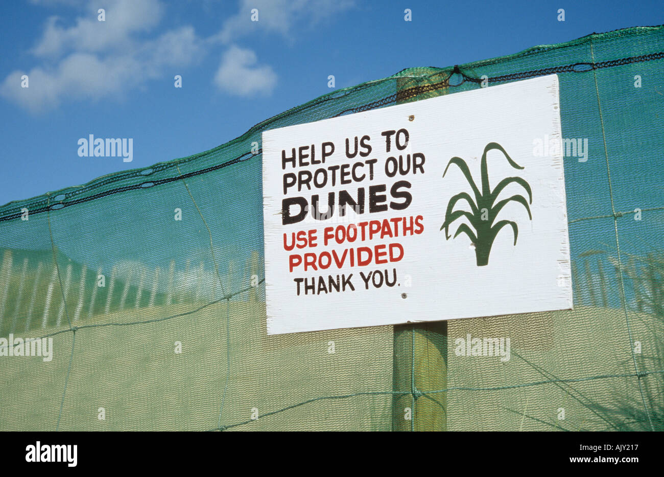 Sign on sand dunes requesting Help to protect and conserve dunes by ...