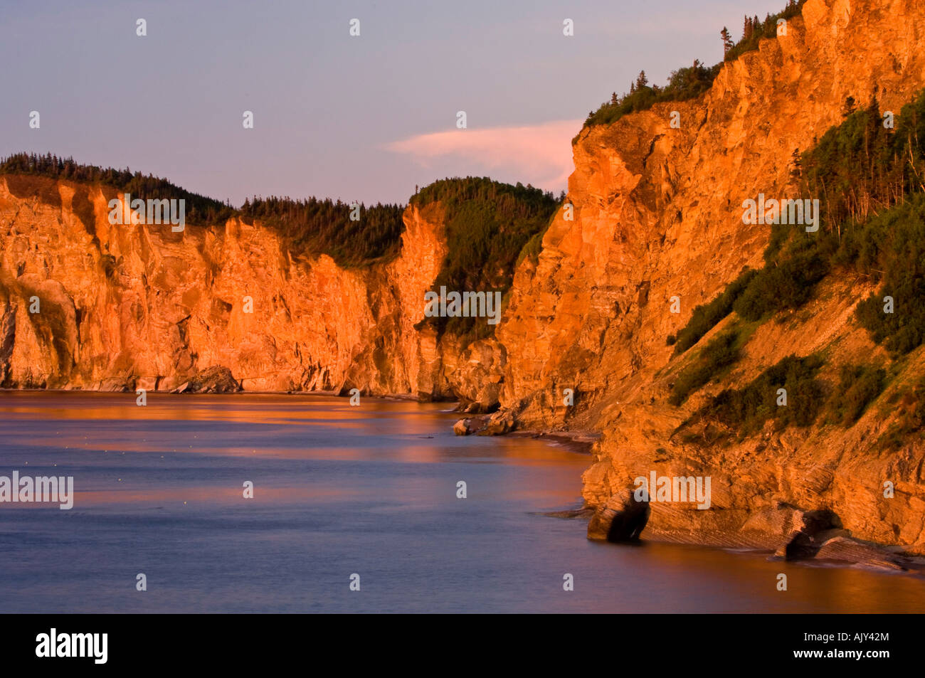 Dawn light on cliffs at Cap-Bon-Ami, Forillon National Park, QC Quebec ...
