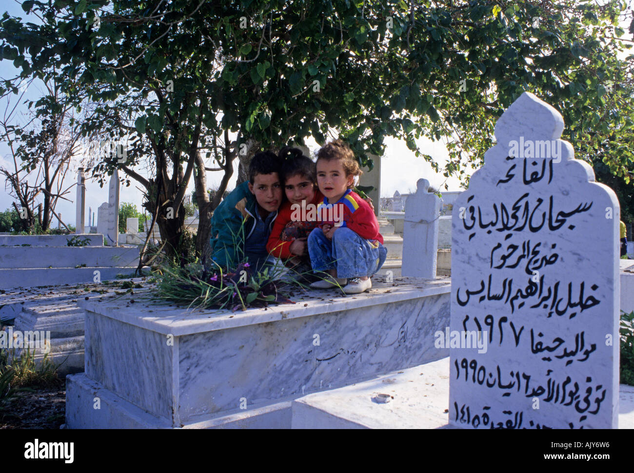 Children playing in a cemetery city of Tyr South lebanon the tombs are ...
