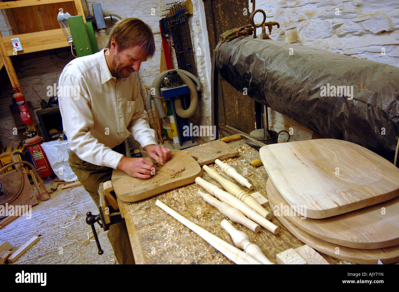 A male woodworker in his workshop, producing chairs Stock Photo - Alamy
