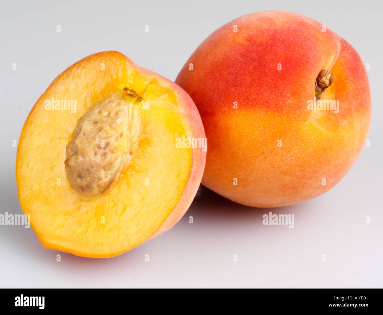 WHOLE PEACH AND HALF Stock Photo - Alamy