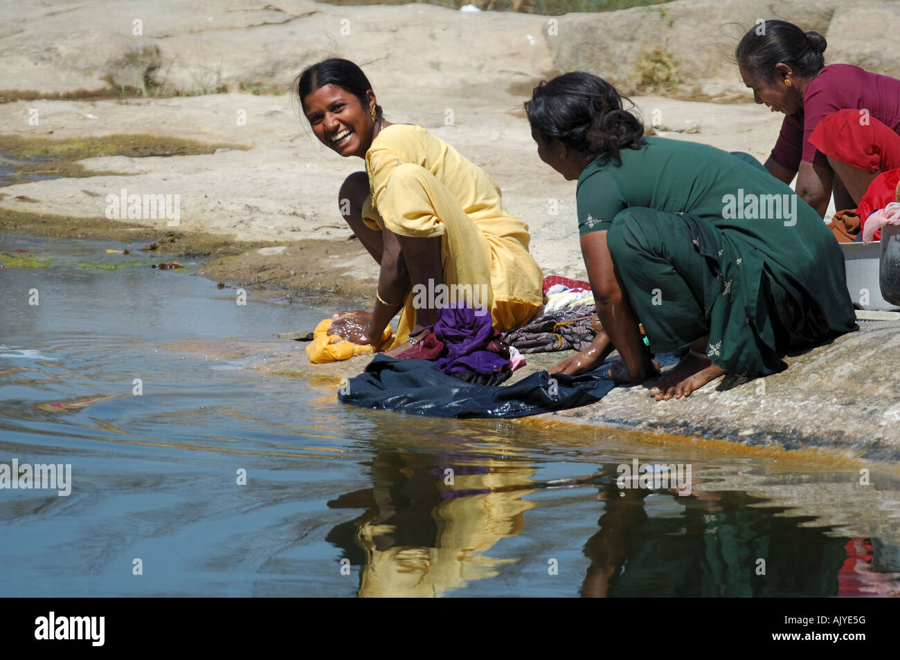 Women washing their clothes in the river near Gir National Park Stock ...