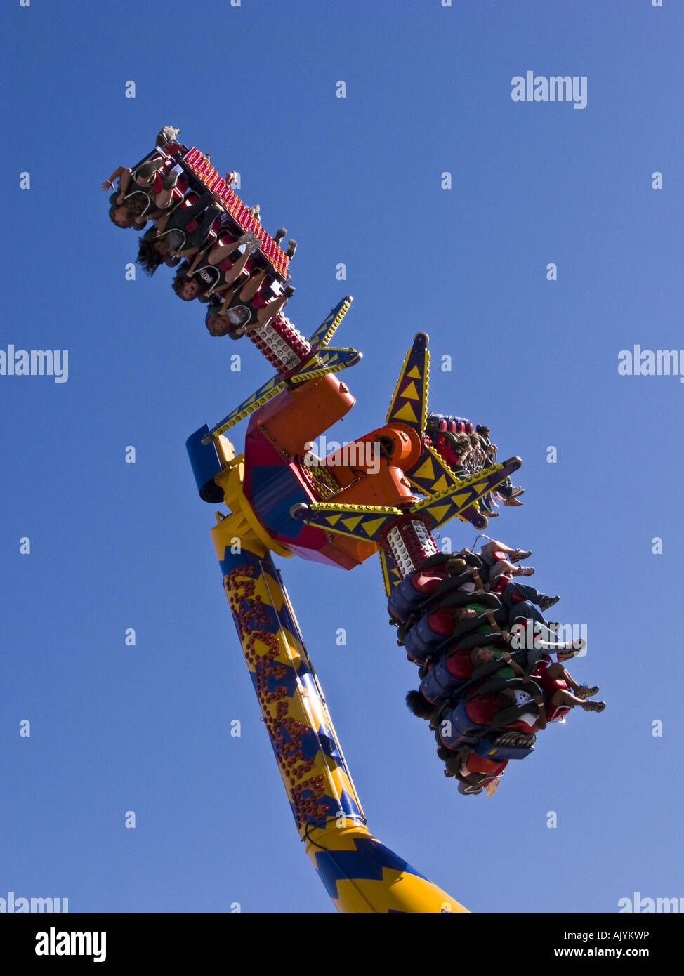 Three arm carnival ride Stock Photo - Alamy