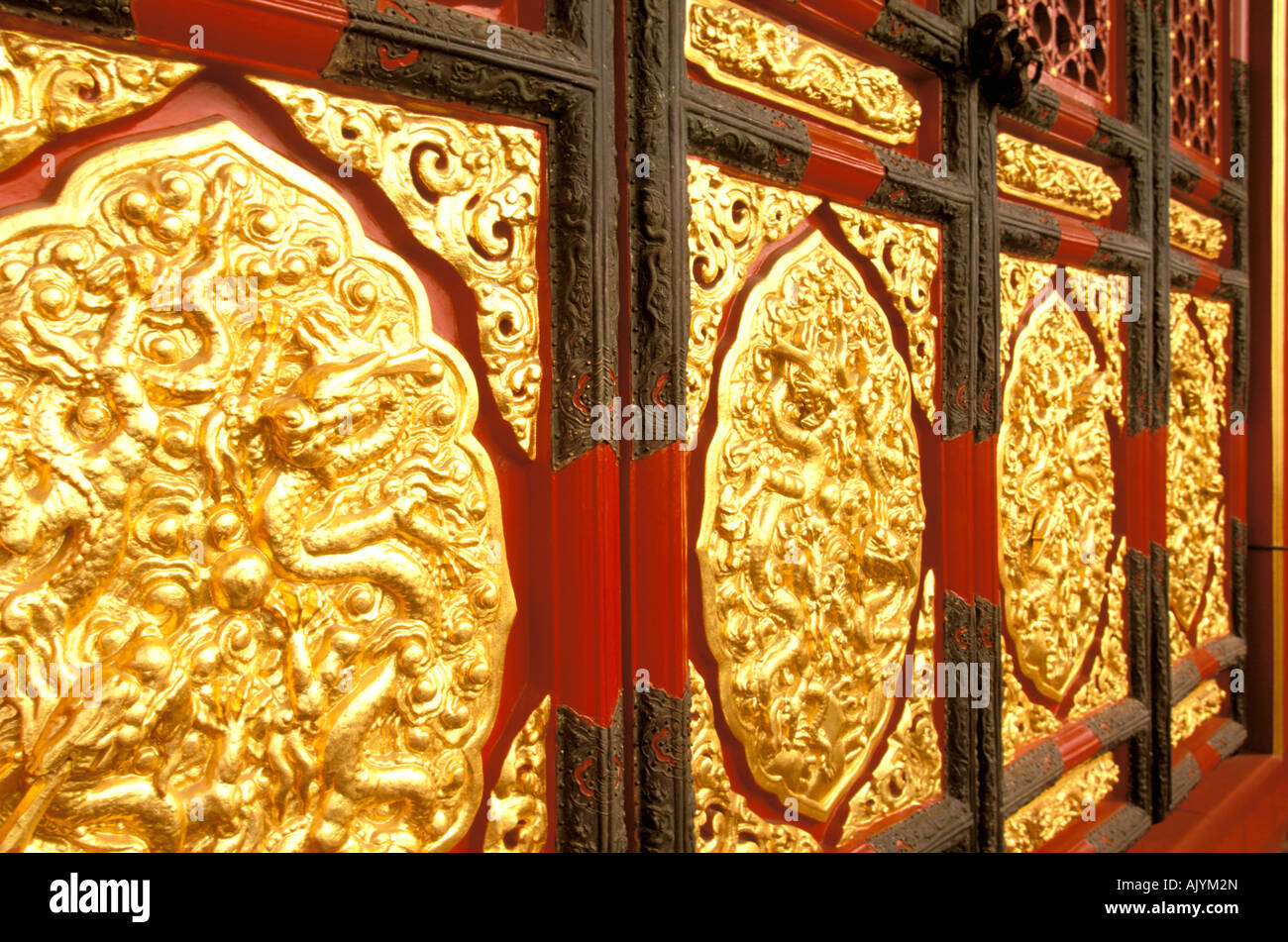 Asia, China, Beijing, Forbidden City. Gilded detail of doors in the ...
